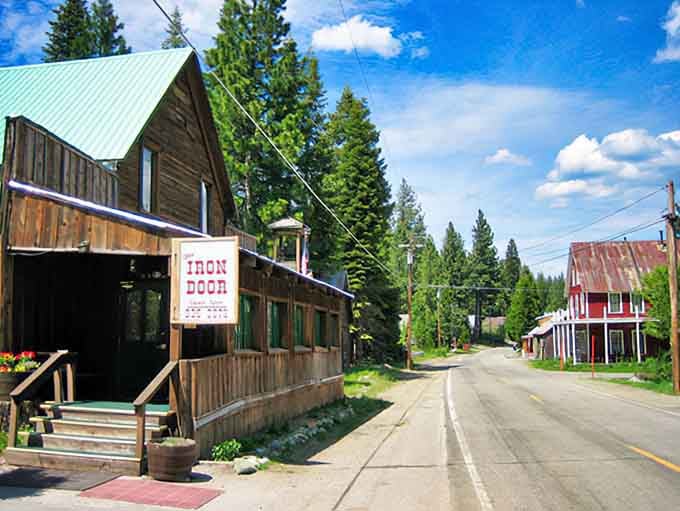 Rustic wooden buildings with flower boxes prove that lumber towns can age gracefully into charming mountain retreats.