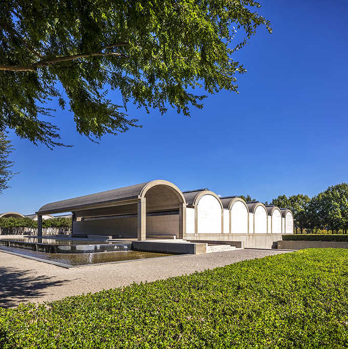 Graceful arches repeat along the reflecting pool like a visual meditation on symmetry and serene beauty.