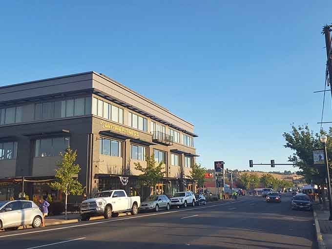 Modern storefronts blend seamlessly with historic architecture in a downtown that balances past and present with impressive grace.