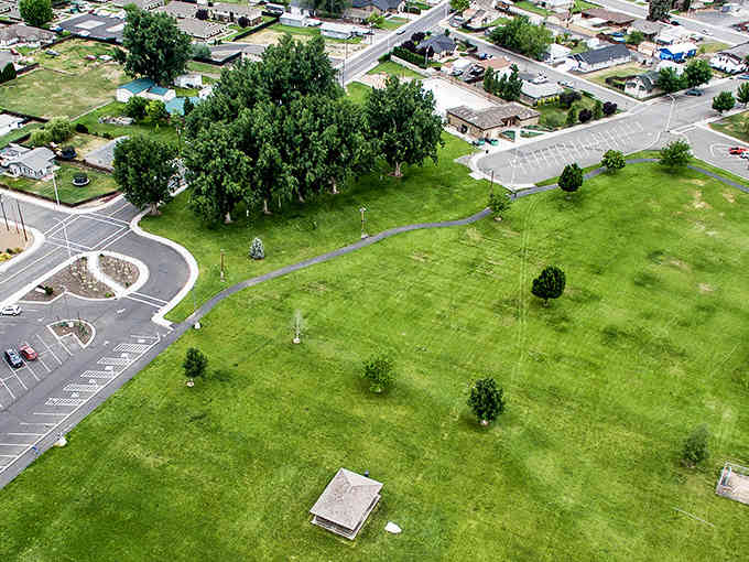 Lush green parks stretch out like nature's own carpet, inviting picnics and afternoon naps under open skies.