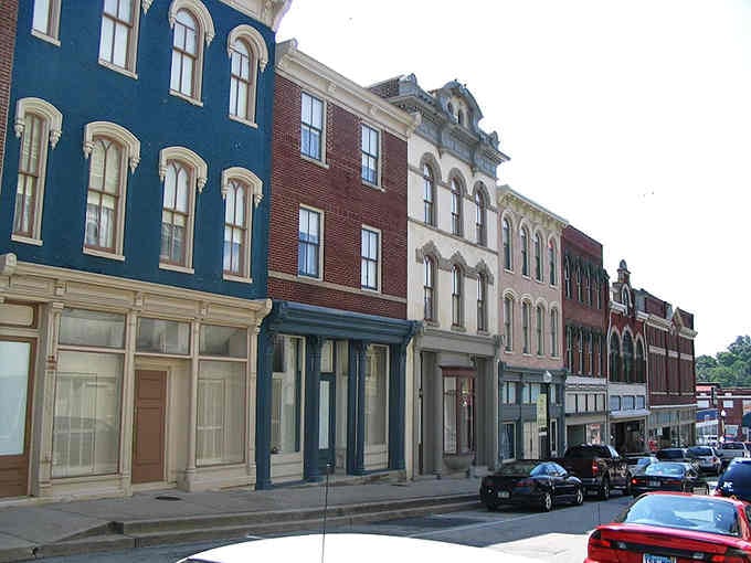 Painted storefronts in cheerful colors create a rainbow of possibilities along this perfectly preserved Main Street scene.