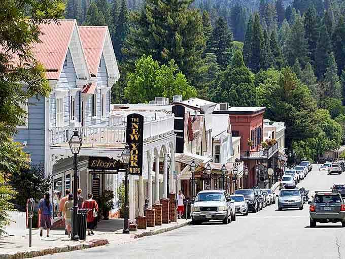 Victorian storefronts line this Gold Rush street where balconies and gingerbread trim create a scene straight from 1849.