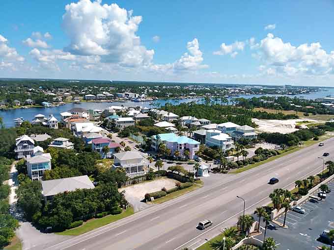 Pastel beach houses dot the coastline where turquoise waters meet sugar-white sand in perfect harmony.