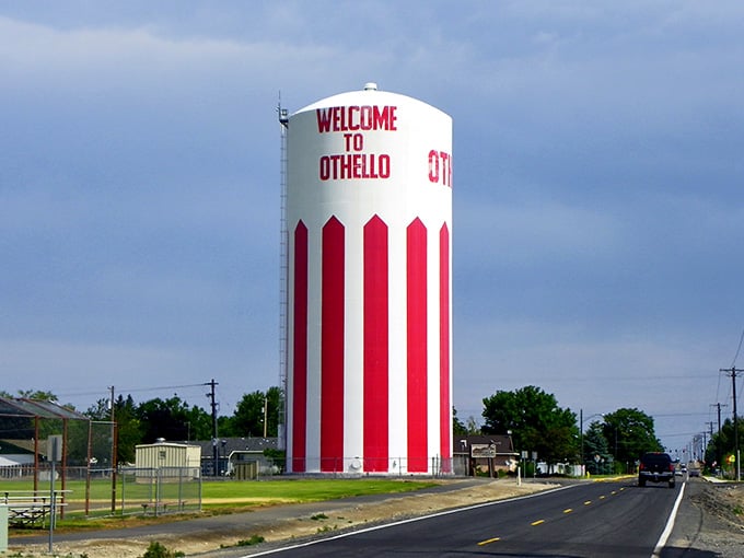 That red-and-white striped water tower welcomes visitors like a cheerful lighthouse guiding ships, except it's guiding retirees to affordability.