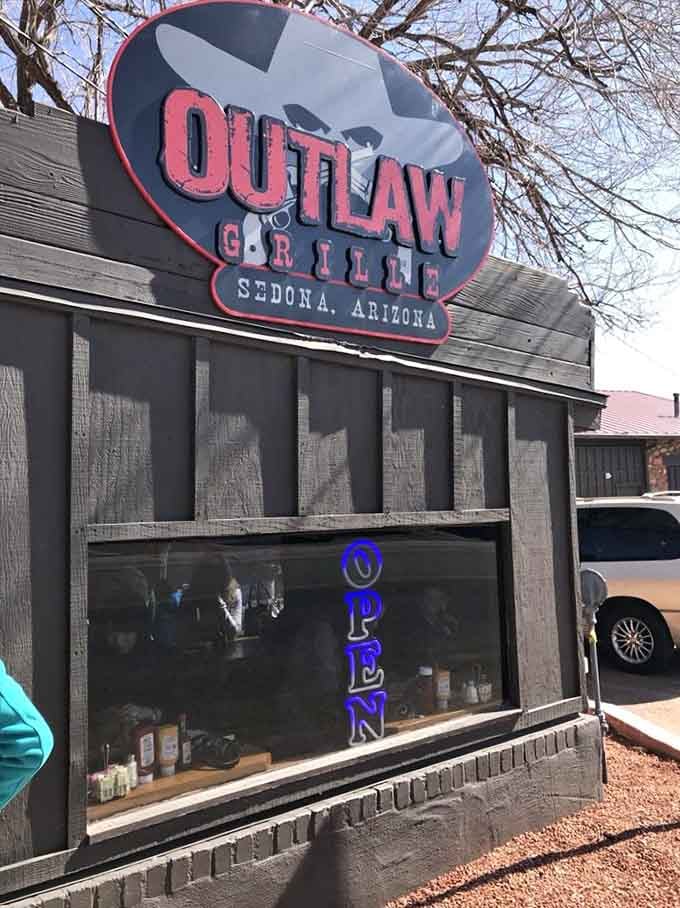 That bold cowboy hat logo and "OPEN" sign welcome you to Western hospitality with a side of juicy burgers.