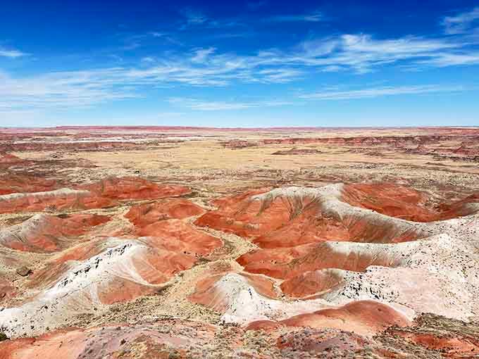 Layers of rust, cream, and rose stripe the badlands like a giant's layer cake baked over millions of years.
