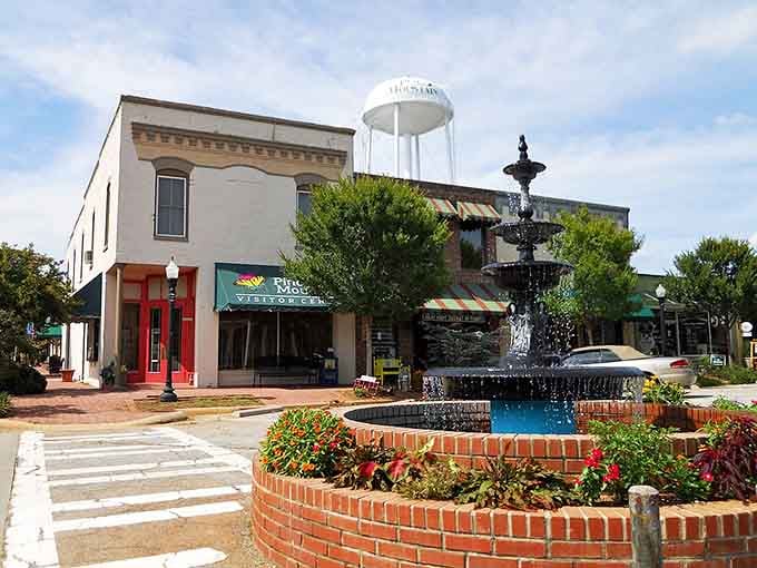 The town fountain bubbles cheerfully, anchoring a square where neighbors still stop to chat and linger.
