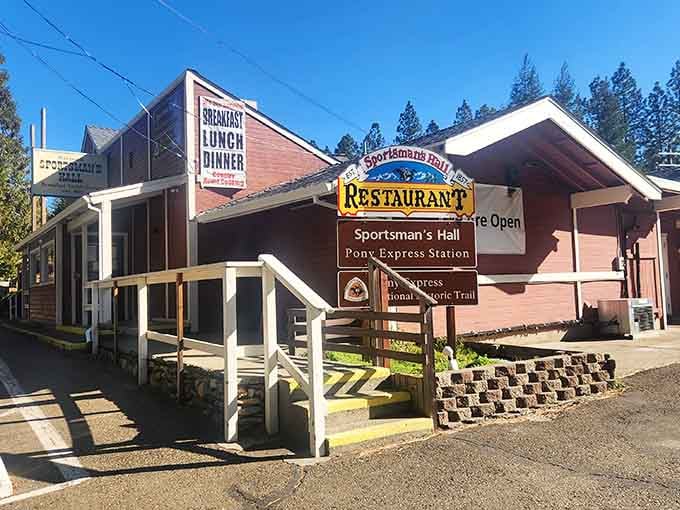 The Sportsman's Hall sign promises breakfast, lunch, and dinner&mdash;mountain hospitality served all day in the pines above.