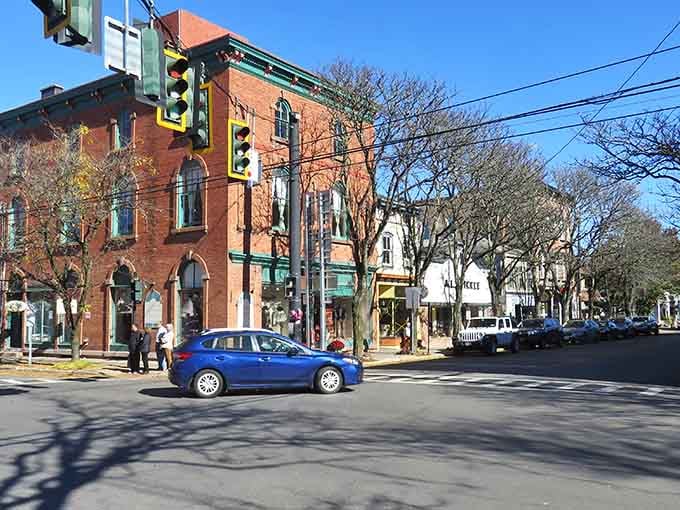Wide intersections and historic buildings showcase small-town planning done right, where pedestrians still rule the crosswalks with confidence.