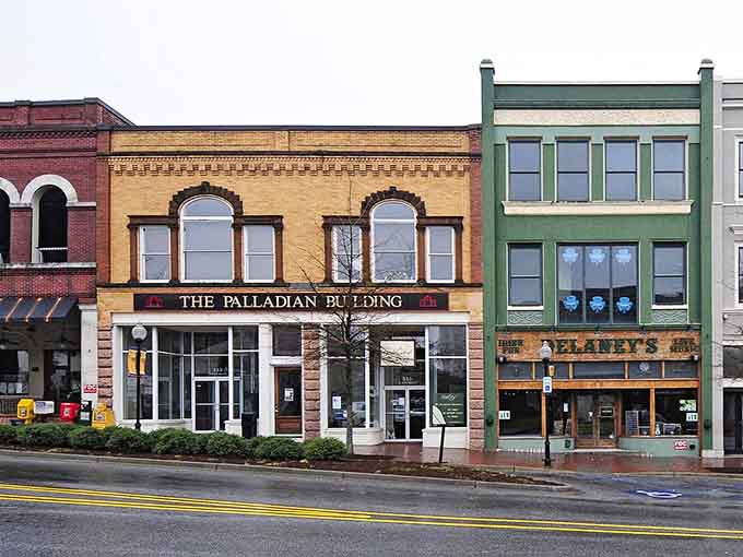 These colorful storefronts stand shoulder to shoulder like old friends sharing secrets across the decades of downtown life.