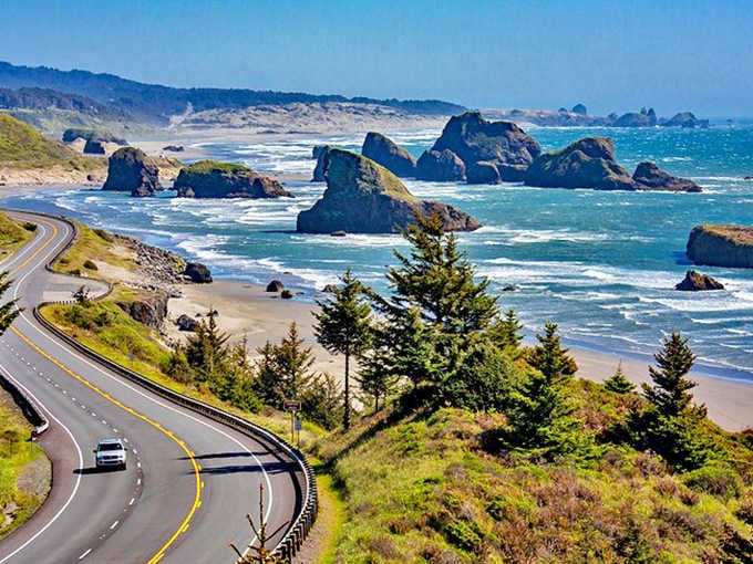 Sea stacks rise from foaming waves like ancient guardians protecting the coastline from Pacific storms and passing centuries.