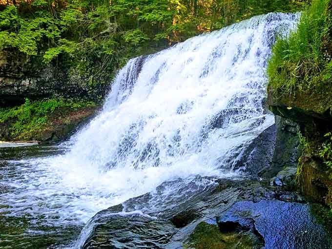 A powerful sheet of water plunges down, creating that satisfying roar you can practically hear through the photo.