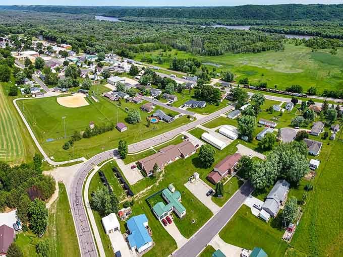 Green fields and tree-lined streets stretch endlessly, showing how nature and neighborhood blend together in perfect harmony.