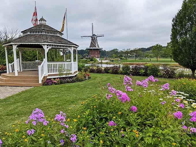 A white gazebo and authentic Dutch windmill create a scene so charming, you'll swear you've stepped into a postcard.