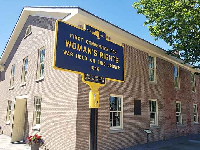 Bold blue and gold lettering announces where brave women gathered to demand rights we now take for granted daily.