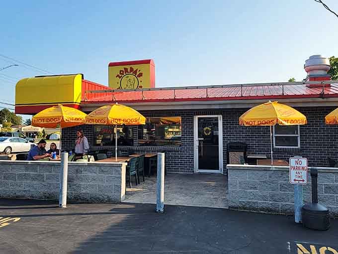 That giant yellow hot dog on the roof is basically a beacon of hope for hungry travelers everywhere.