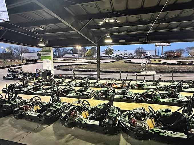 Rows of yellow and black karts stand ready like a fleet of tiny race cars awaiting their next drivers.