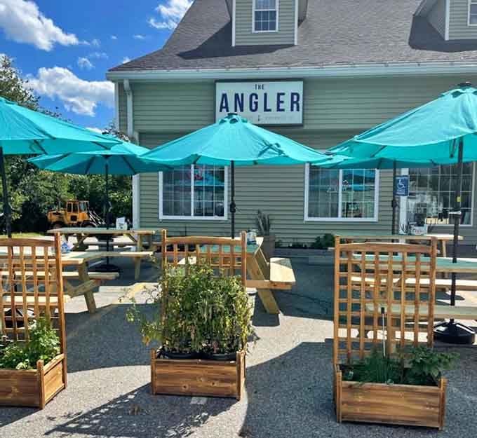 Those turquoise umbrellas and herb planters transform a simple patio into a Mediterranean-style dining oasis.