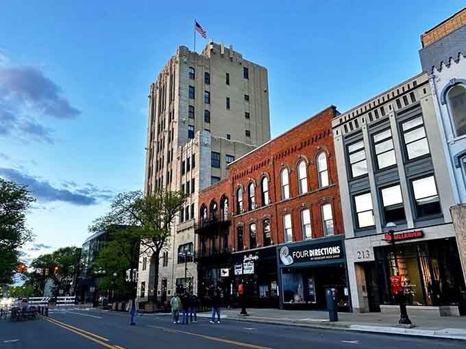 Evening shadows stretch across downtown streets where historic buildings create a skyline that's distinctly collegiate and charming.