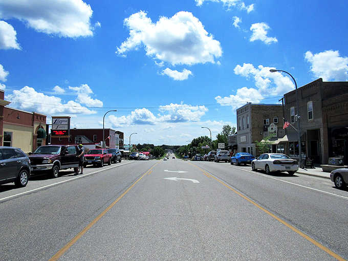 That endless prairie sky stretches over main street like a blue canvas, reminding you why they call it Big Sky Country's neighbor.