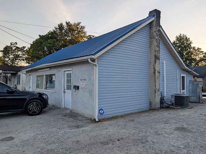 Golden hour light bathes this humble structure, making it glow like the hidden treasure it truly is for seafood lovers.