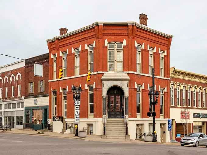 That corner building's ornate stonework and arched entrance show craftsmanship that would cost a fortune to replicate today.