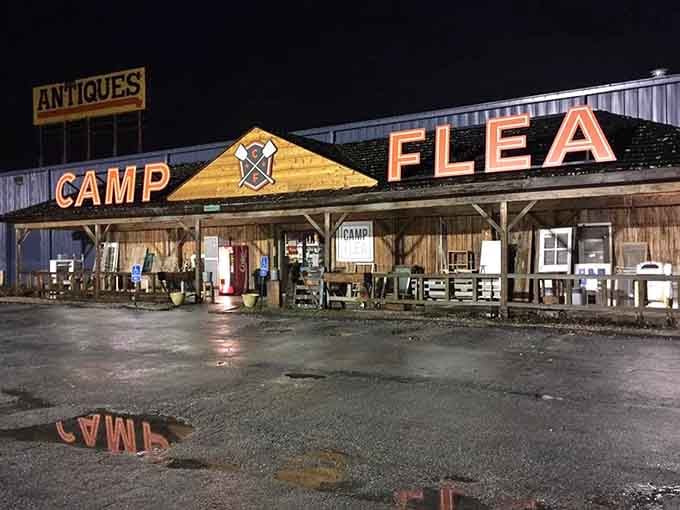 The Camp Flea sign glows warmly at night, proving great finds don't keep regular business hours.
