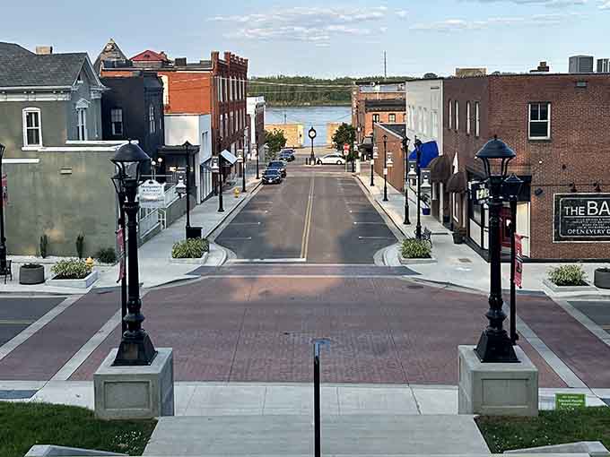 The river peeks through at the end of this beautifully restored street, promising adventures just beyond downtown.