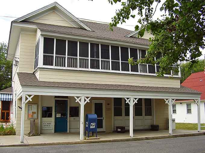 The screened porch upstairs suggests summer evenings spent watching fireflies, not scrolling through endless social media feeds.