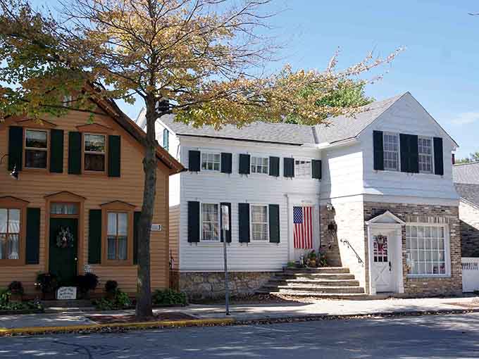 Classic white clapboard houses line up like old friends, their black shutters and flags celebrating small-town American pride.