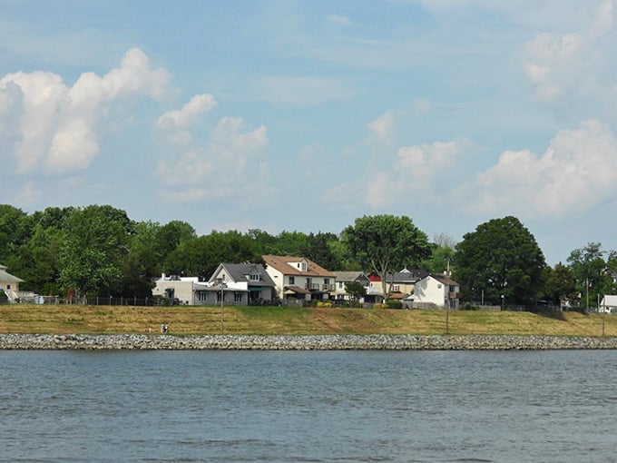 Summer clouds float over shoreline homes that have weathered storms and sunny days with equal grace and charm.