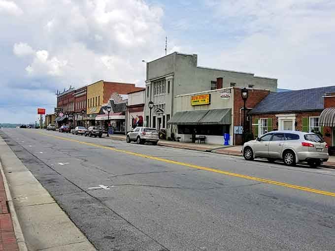 Explore the quiet charm of a small-town main street, lined with local businesses and plenty of space for a stroll.