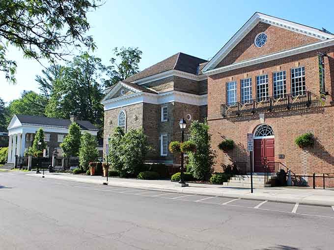 Classic brick architecture with white trim details shows civic pride that's been maintained carefully across multiple generations of townsfolk.