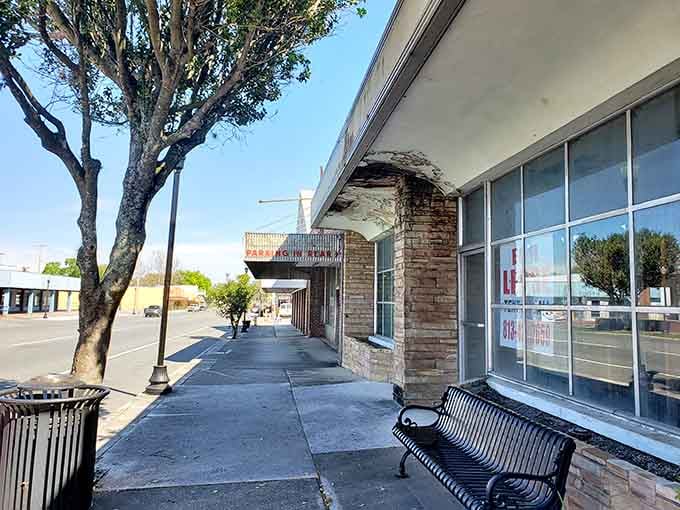 Shaded sidewalks and vintage storefronts create the kind of atmosphere where meals become cherished afternoon events.