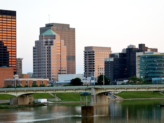 The Dayton skyline reflecting in the river shows a city that's learned to balance progress with preserving the natural beauty that makes life worth living.