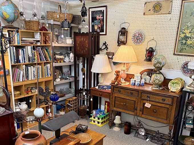 Cozy booth displays mix furniture, books, and vintage globes like someone's well-traveled grandmother's attic came to life.