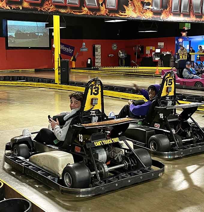 Young racers grip the wheel with determination, ready to create memories that'll last longer than any video game score.