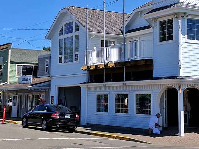 Coastal architecture with white siding and balconies catches the ocean breeze in this charming seaside spot.