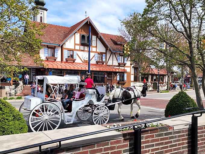 A horse-drawn carriage clip-clops past timber-framed buildings, transporting visitors back to simpler, gentler times.