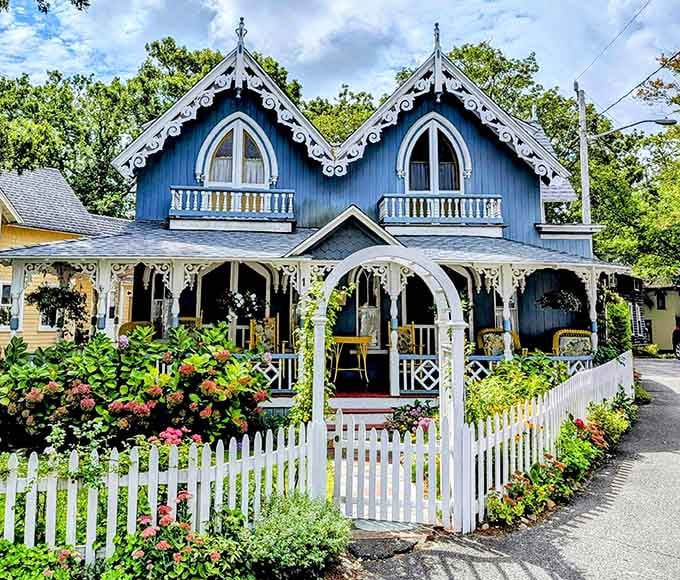 White picket fence, lacy woodwork, and blooming gardens create a storybook scene that makes everyone smile instantly.