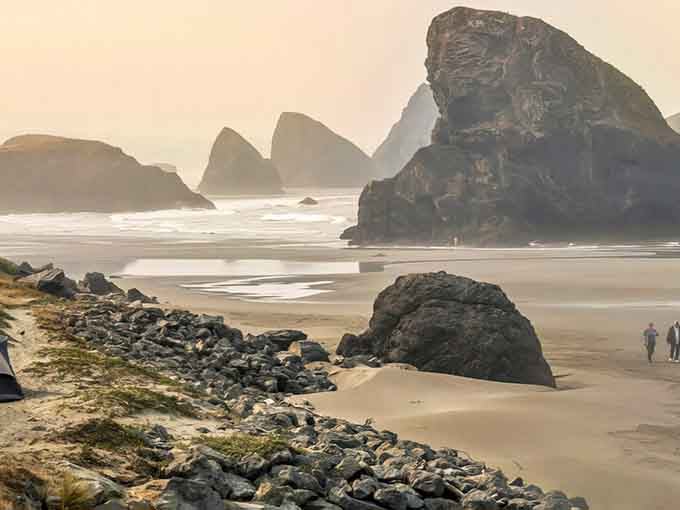Morning mist wraps around rocky outcrops while the beach stretches endlessly, inviting long walks and deep thoughts about everything.
