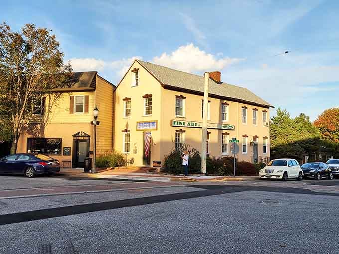 Golden hour transforms this quiet street into something Norman Rockwell would've painted, complete with that cozy neighborhood restaurant glow.