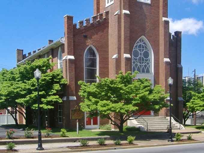 Gothic windows and manicured lawns surround this church that's been anchoring the community through generations of Sunday services.