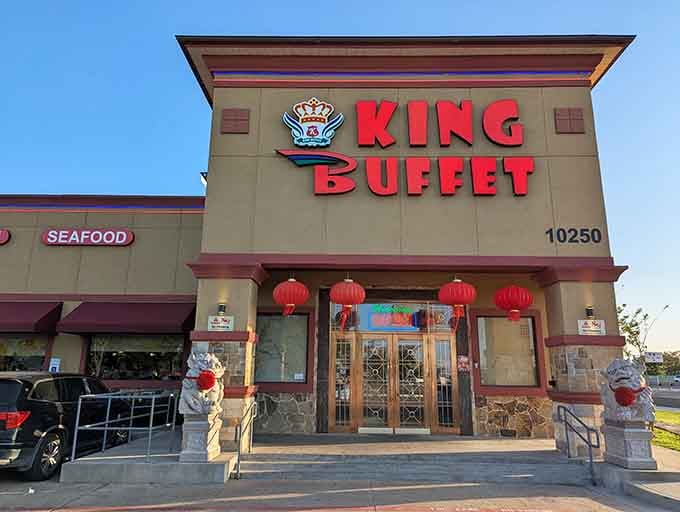 Red lanterns and guardian lions frame the entrance like a welcoming committee ready to feed your hungry soul.