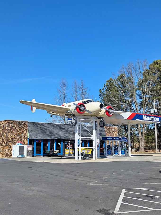 Those red propeller tips catch the winter sunlight perfectly &ndash; fill up your tank while admiring this magnificent flying machine overhead.