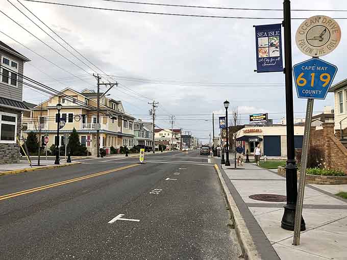 Classic shore architecture lines this peaceful street, where the promise of salt air and seafood is just ahead.