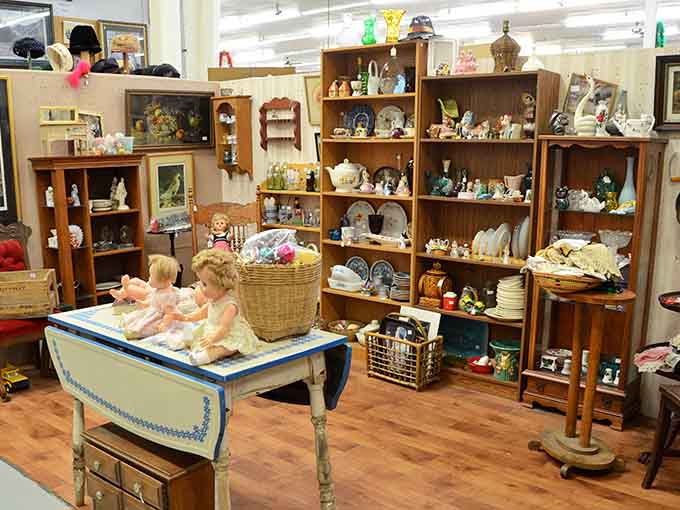 Shelves overflow with vintage china, dolls, and home decor items that bring back memories of simpler, sweeter times.