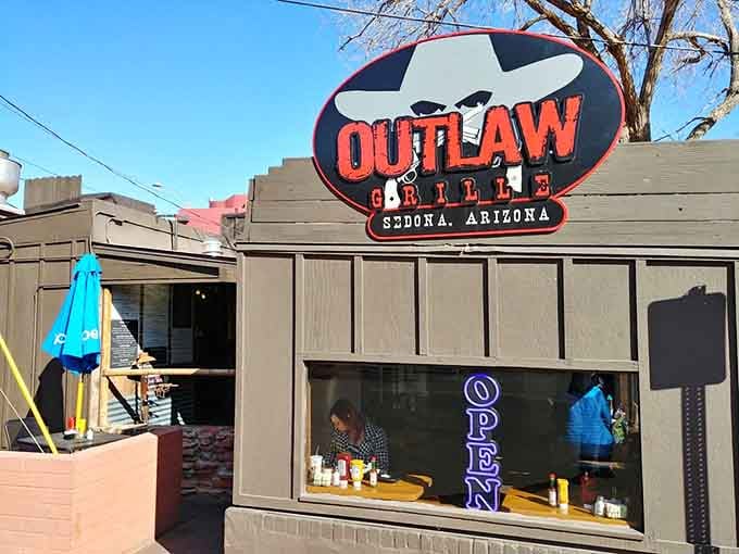 The rustic wood exterior and that inviting sign promise authentic grilled goodness in every single bite you take.