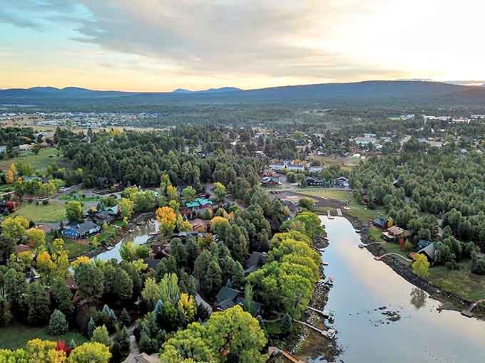 From up here, the town spreads out like a green quilt stitched together with winding roads.