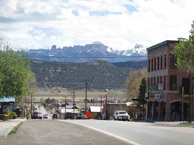 Snow-capped mountains provide the backdrop for this peaceful main street where time moves at a refreshingly slower pace.